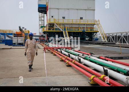A Ugandan worker from China Oilfield Services Limited (COSL), a ...