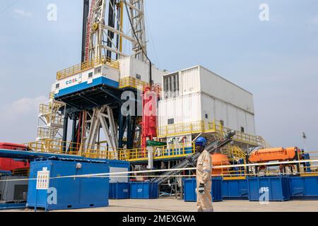 A Ugandan worker from China Oilfield Services Limited (COSL), a ...