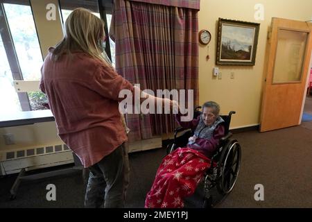 Chaparral House activities director Erika Shaver-Nelson, left, talks ...