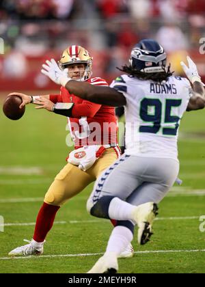 Seattle Seahawks defensive tackle Myles Adams (95) jogs off th field ...
