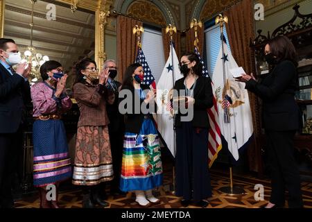 Interior Secretary Deb Haaland, third from left, hugs partner Lloyd ...