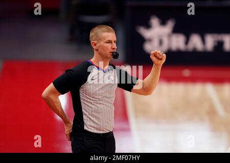 Referee Tyler Ford signals during the second half of an NBA basketball ...