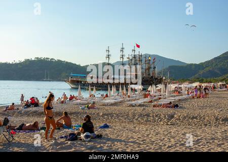 Beachgoers and paragliders in Belcekiz Beach, Oludeniz, Fethiye, Turkey ...