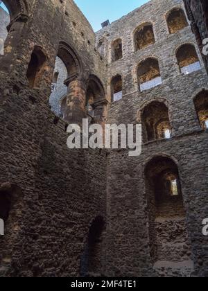 Inside the ruins of Rochester castle looking up at the stone structure ...