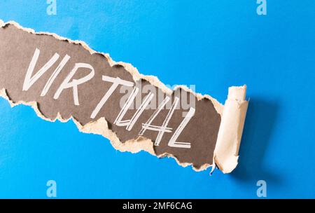 The word VIRTUAL is written on a wooden block on a computer keyboard ...