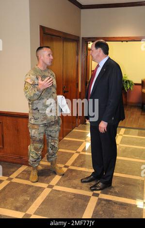 Col. Sam Smith, garrison commander, shakes hand after acknowledging ...