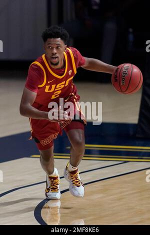 Southern California guard Tahj Eaddy, left, reacts after making a game ...