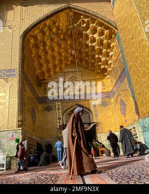 Shiite Muslim worshippers pray inside the holy shrine of Imam Ali, the ...