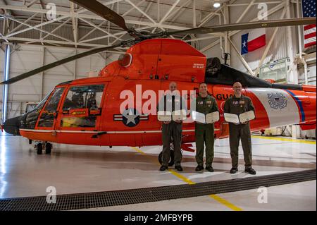 Cmdr. James Conner, an MH-65 Dolphin helicopter pilot, is presented an ...