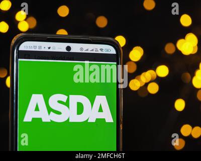 In this photo illustration, an Asda logo is displayed on a smartphone ...