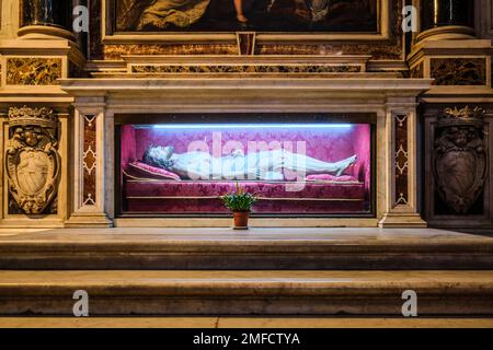A dead Jesus Christ, lying in state in a glass case. Detail of the ...
