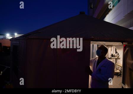 Dr. Jim Keany, an emergency medicine specialist, shows a triage tent ...