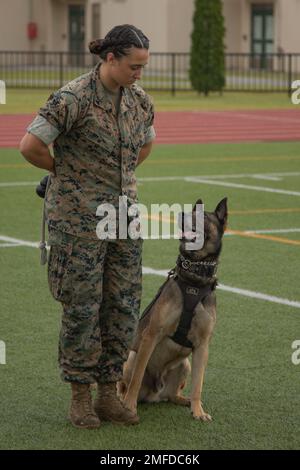 U.S. Marine Corps Cpl. Maria Busson, left, and Cpl. Elijah Stoker ...