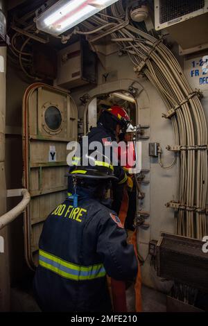 A Coast Guard Cutter Sequoia (WLB 215) boarding team along with an ...