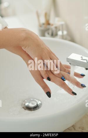 hand washing under the tap closeup Stock Photo - Alamy