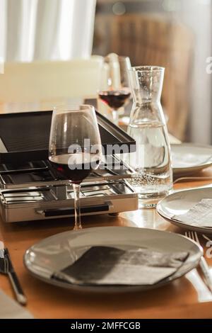 Bottle of red wine with wineglass. Water splash and droplet on the ...