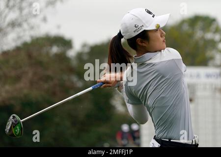 Yu Liu, of China, follows through on a shot on the second hole during ...