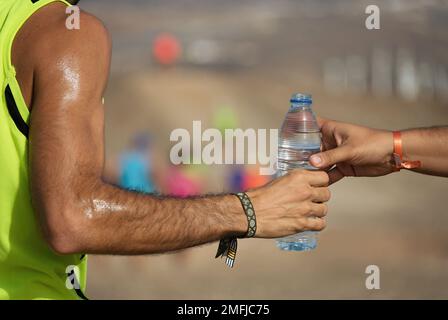 Drinks station at a trail running marathon,hydration drinking during a ...