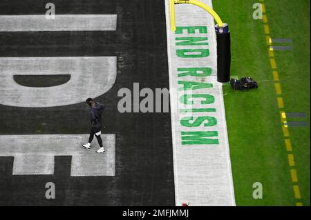 End Racism is written in the end zone before an NFL football game ...