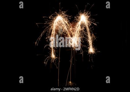 Different figures, letters or drawings created at night with flares ...