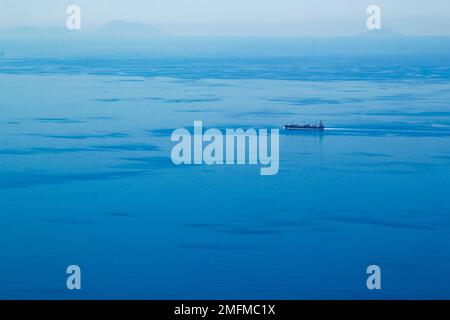 maritime coast of the Tyrrhenian Sea with merchant ship, travel ...