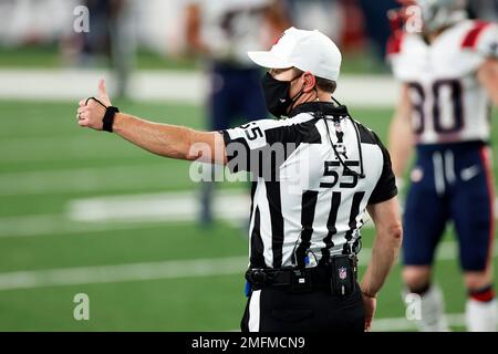 Referee Alex Kemp (55) gestures during an NFL football game between the ...