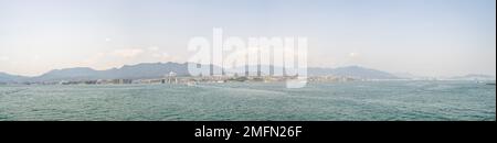 Beautiful panoramic landscape of Miyajima city with ferry boat from the ...