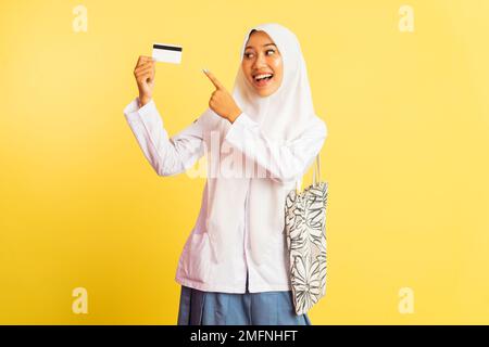 veiled school girl showing blank screen with pointing finger Stock ...