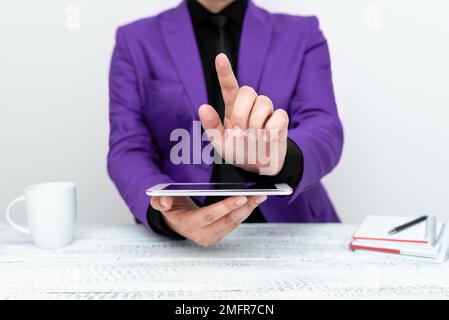 Businessman in Purple jacket sitting at table holding mobile phone And ...