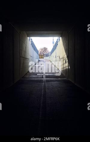Entrance of a passageway under a highway Stock Photo - Alamy