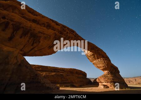 Starry sky above The Arch, also known as Rainbow Rock, near AlUla ...
