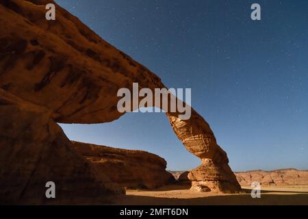 Starry sky above The Arch, also known as Rainbow Rock, near AlUla ...