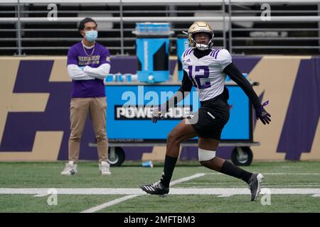 Washington wide receiver Puka Nacua takes part in NCAA college football ...