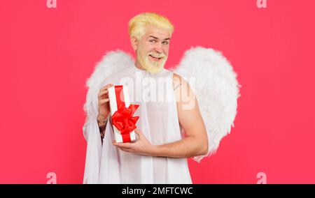 Bearded man in angelic wings with red paper heart. Valentines day card ...