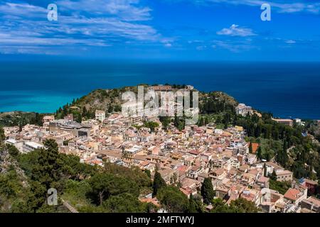 Aerial view of the town of Taormina, located on a hill overlooking the ...