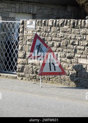 Road sign lane narrowing. In the background, blurred a roadworks Stock ...