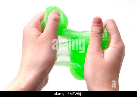 Hand Playing with textured slime on white background. Teen hand holding ...