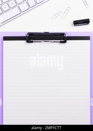 Paper with important text near keyboard. Information written on ...