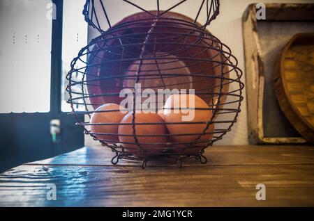 Old rusty wire egg cup. Country style background. Long format Stock ...