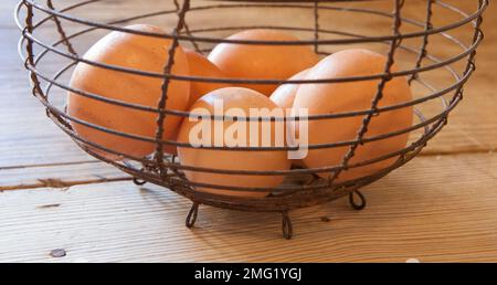 Old rusty wire egg cup. Country style background. Long format Stock ...