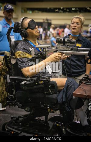 U.S. Army Capt. Luis Avila receives a gold medal for seated shot put ...