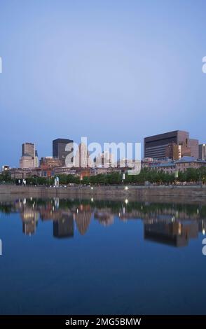 Old Montreal skyline reflected in Bonsecours Basin at dawn, Quebec ...