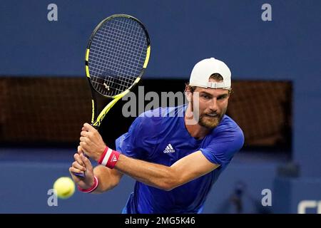 Maxime Cressy, of the United States, returns to Jack Sock, of the ...