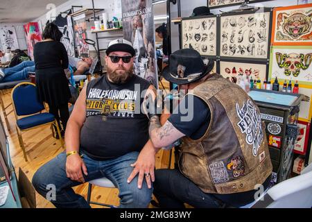 Sean Toyra is tattooed by Isaac Velasco during the 80th annual Sturgis ...