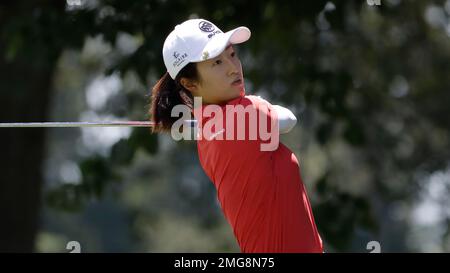 Yu Liu, of China, follows through on a shot on the second hole during ...