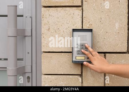Child using intercom outdoors, closeup Stock Photo - Alamy