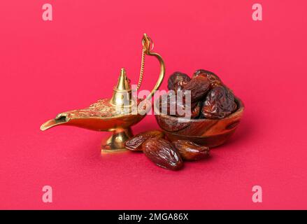 Aladdin lamp of wishes and dates for Ramadan on red background Stock ...
