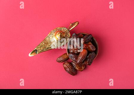 Aladdin lamp of wishes and dates for Ramadan on red background Stock ...