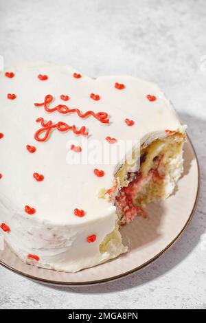 Plate with heart-shaped bento cake on white background. Valentine's Day ...