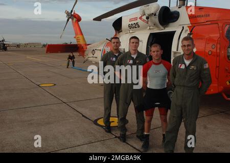 . Coast Guard air crew in front HH-60 on ramp --- 050924. Hurricane ...